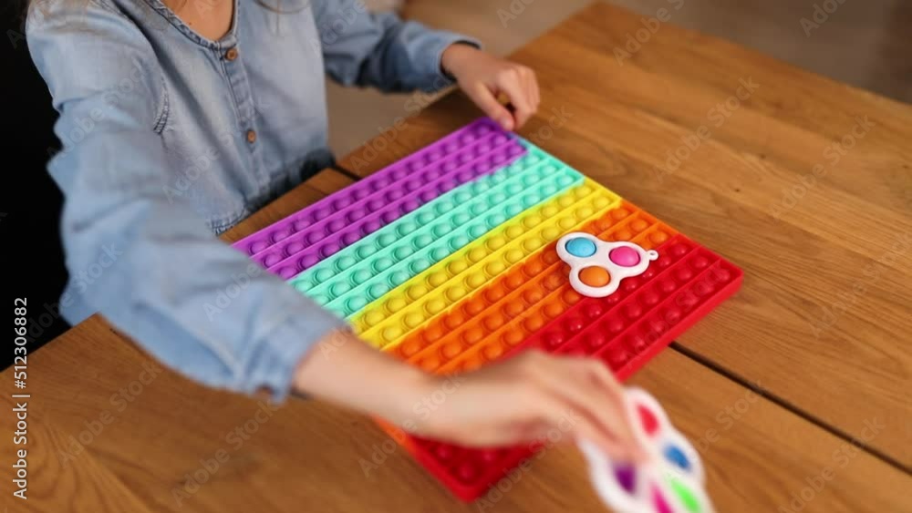 Child girl throws out big silicone popit, simple dimple, bubble fidget ...