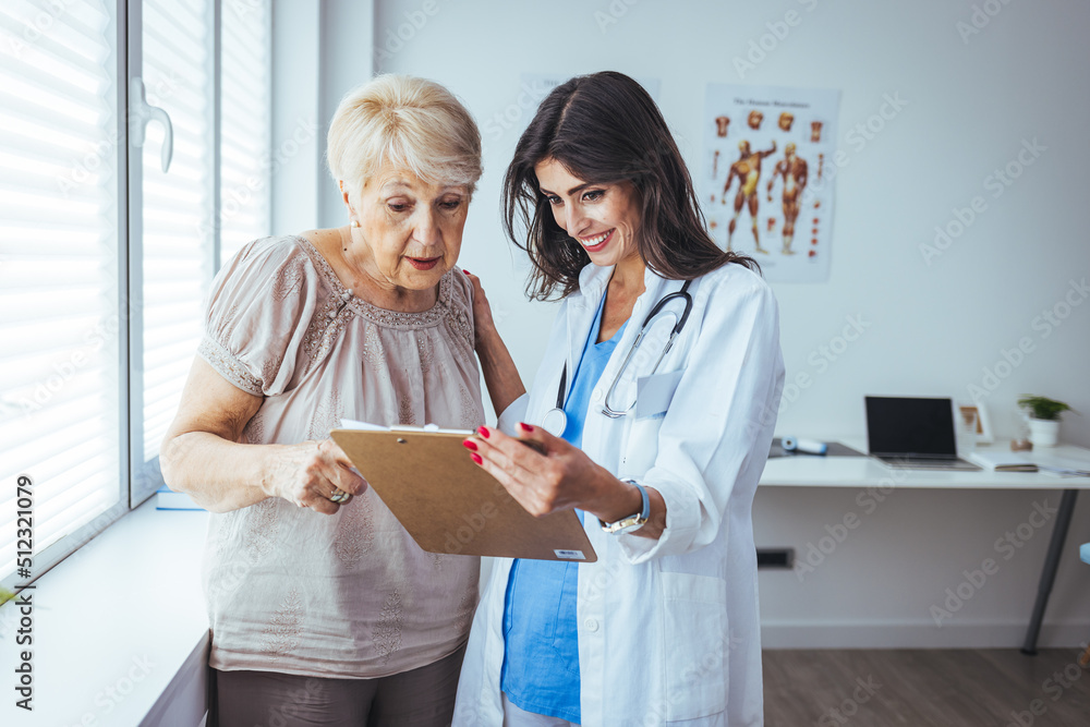 Doctor and patient are discussing. Focused two different generations ...