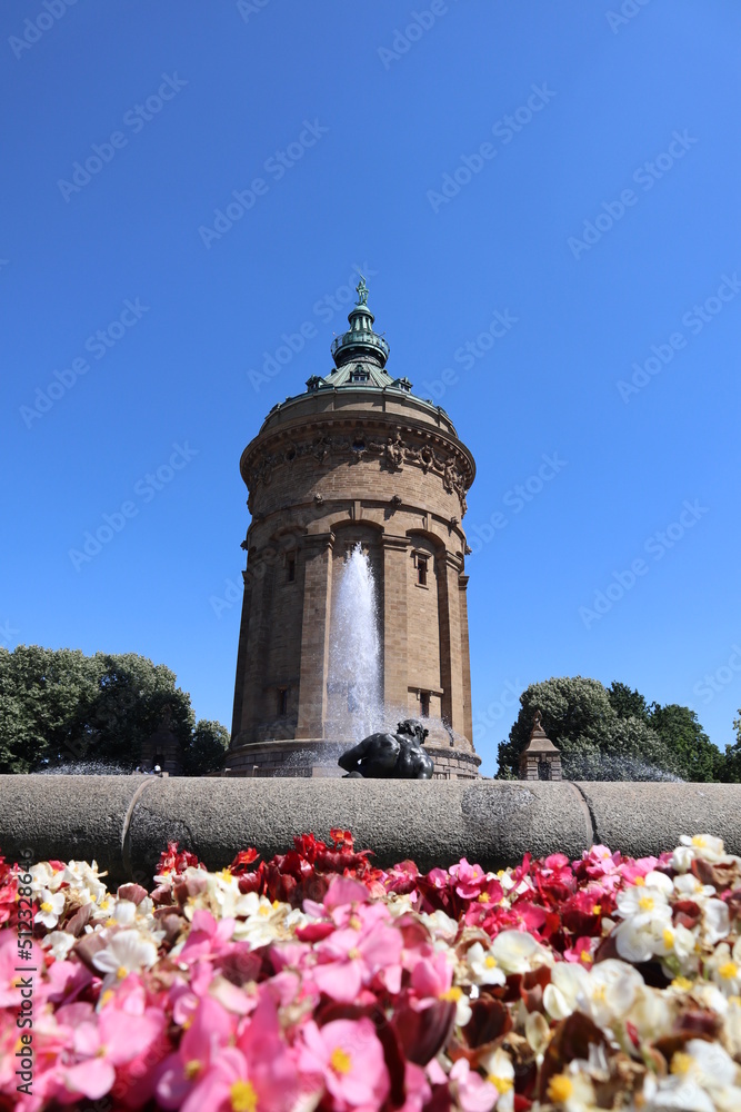 Wasserturm mit Brunnen und Blumen Stock Photo | Adobe Stock
