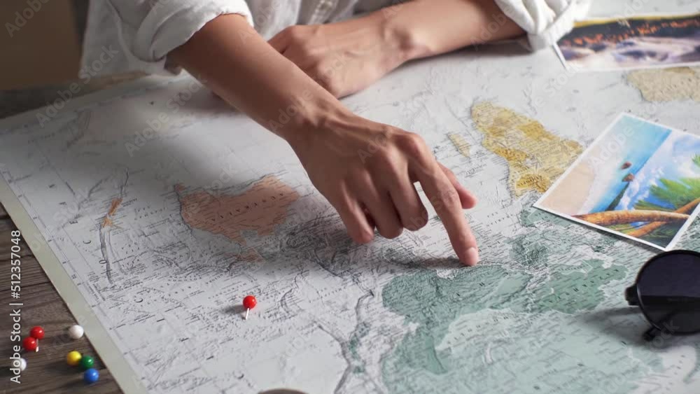 Tourist vacation planning with help world map with tourist accessories ...