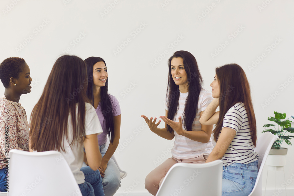 Group of women talking about something. Happy beautiful young girls ...