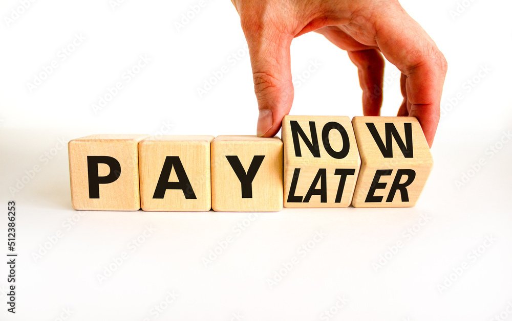 Pay later or now symbol. Businessman turns wooden cubes and changes ...
