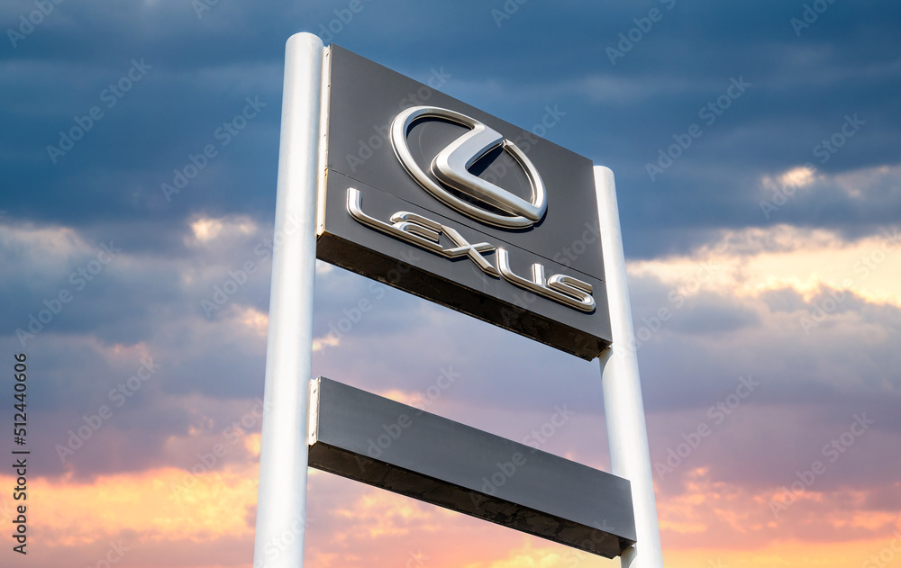 Lexus automotive dealership sign against the sunset sky Stock Photo ...