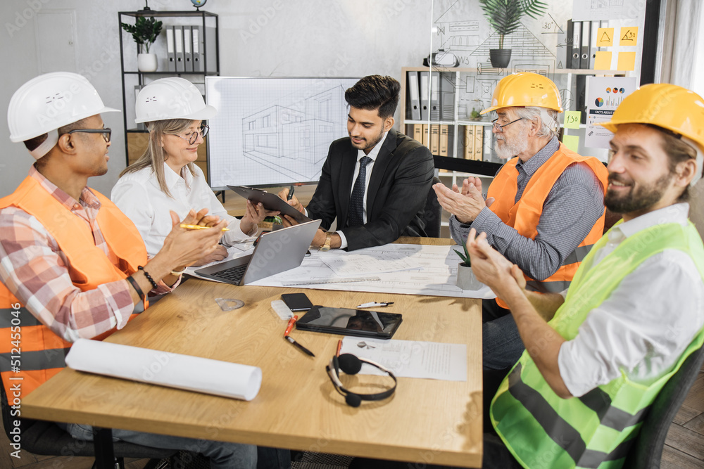 Business people working on common building project. Indian businessman ...