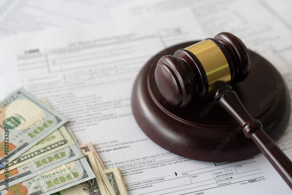 taxation law concept. judge gavel and money on individual income tax ...