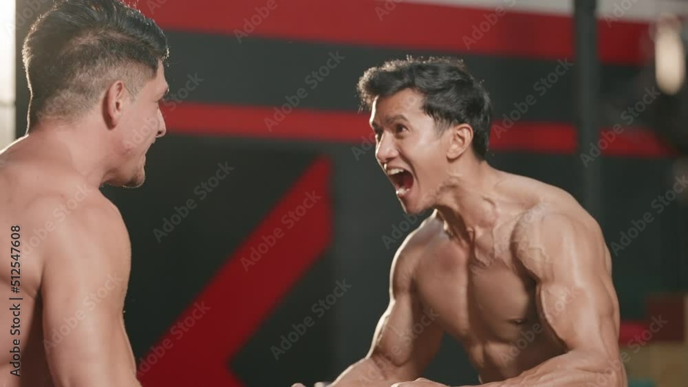 Two muscular man standing, shirtless, showing chiseled torso, abs and ...