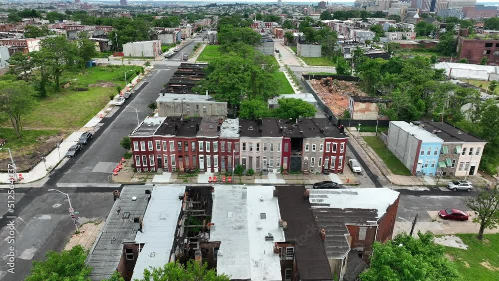 Urban city homes in unsafe neighborhood community. Boarded up houses in ...