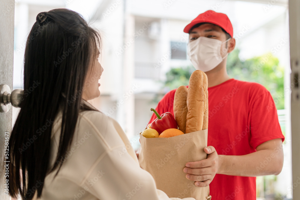 Food delivery staff wearing masks during the Covid-19 outbreak. Postman ...