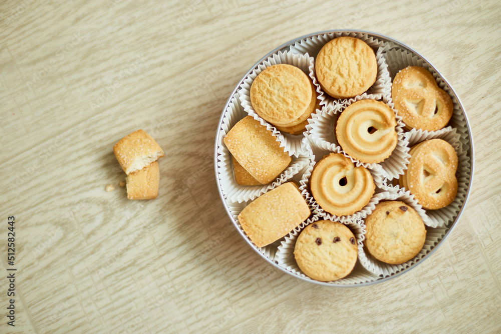Top view tasty danish butter cookies in a tin box , set of crispy ...