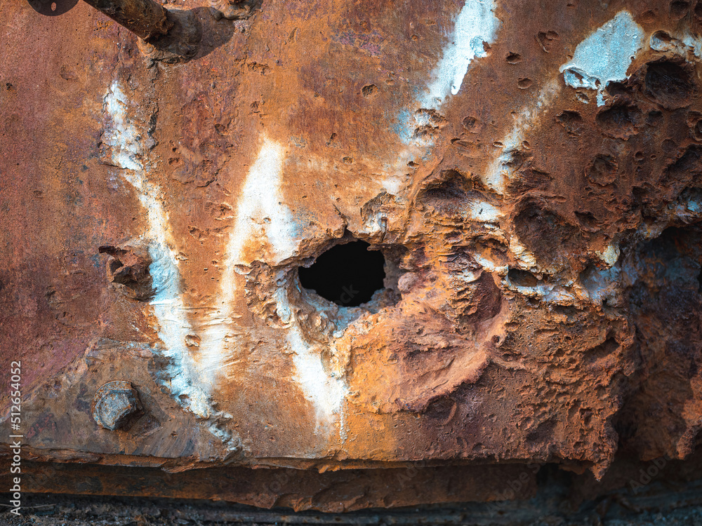 War in Ukraine, pierced armor, a hole in the armor of a tank turret, a ...