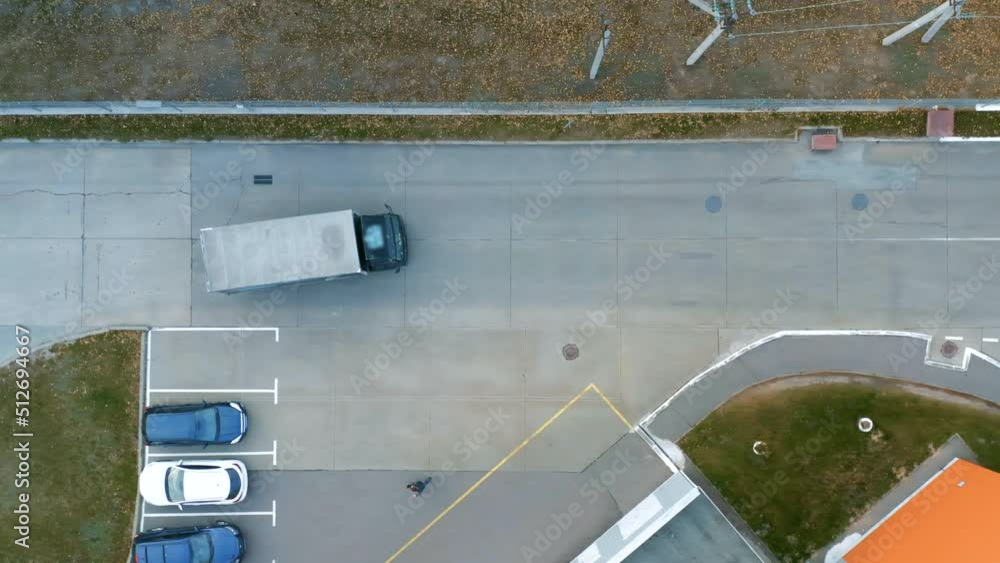 Aerial top down view of the semi-trailer truck maneuvers along a ...