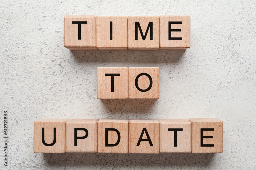 Text TIME TO UPDATE made of wooden cubes on light background Stock ...