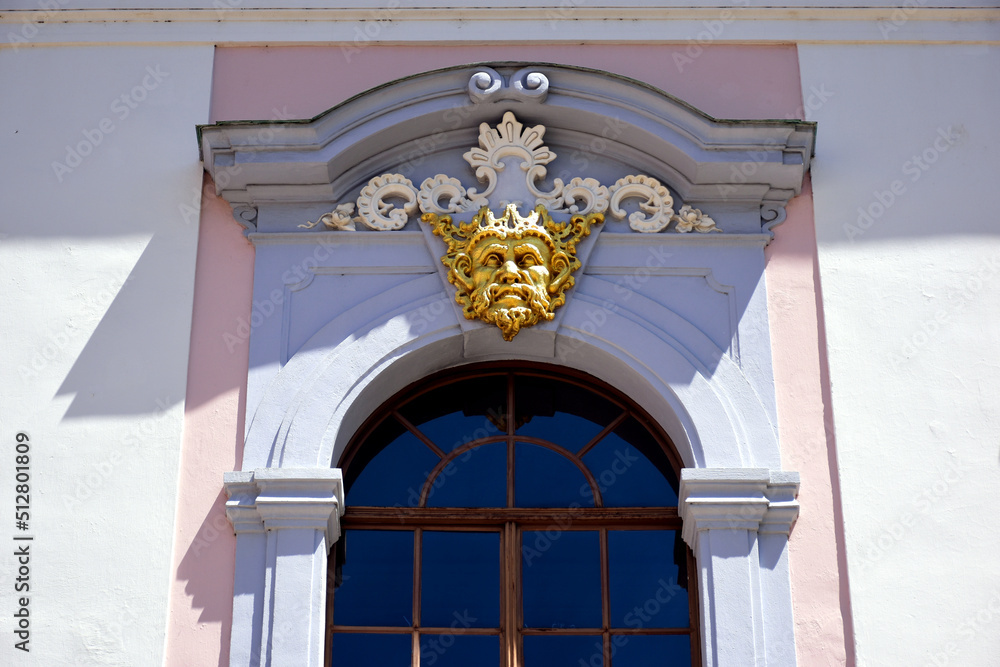 richly decorated ornate baroque window detail. stucco facade. gilded ...