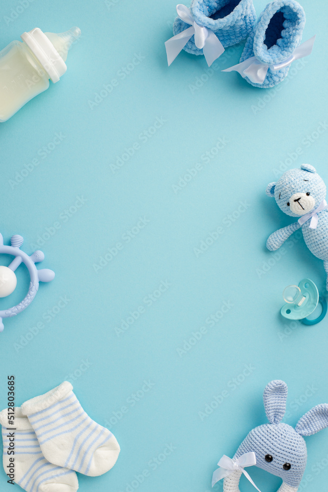 Baby boy concept. Top view vertical photo of booties socks soother ...