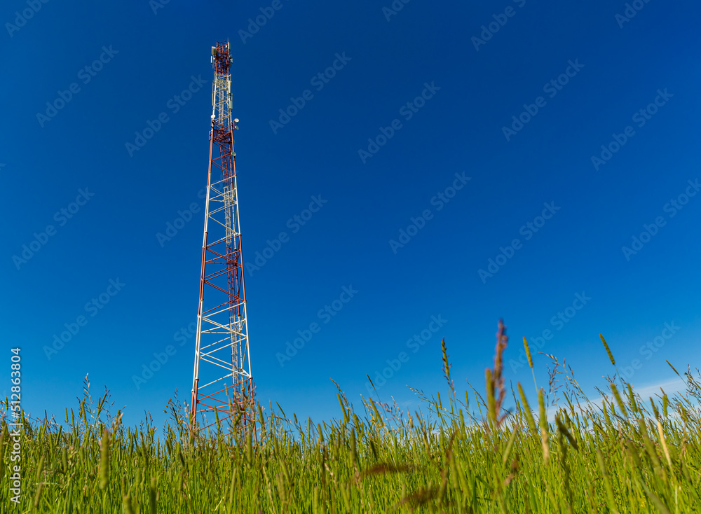 Sun and the telecommunication tower with microwave, radio panel ...