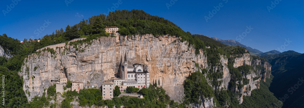Madonna della Corona Sanctuary aerial panorama, surrounded by mountains ...