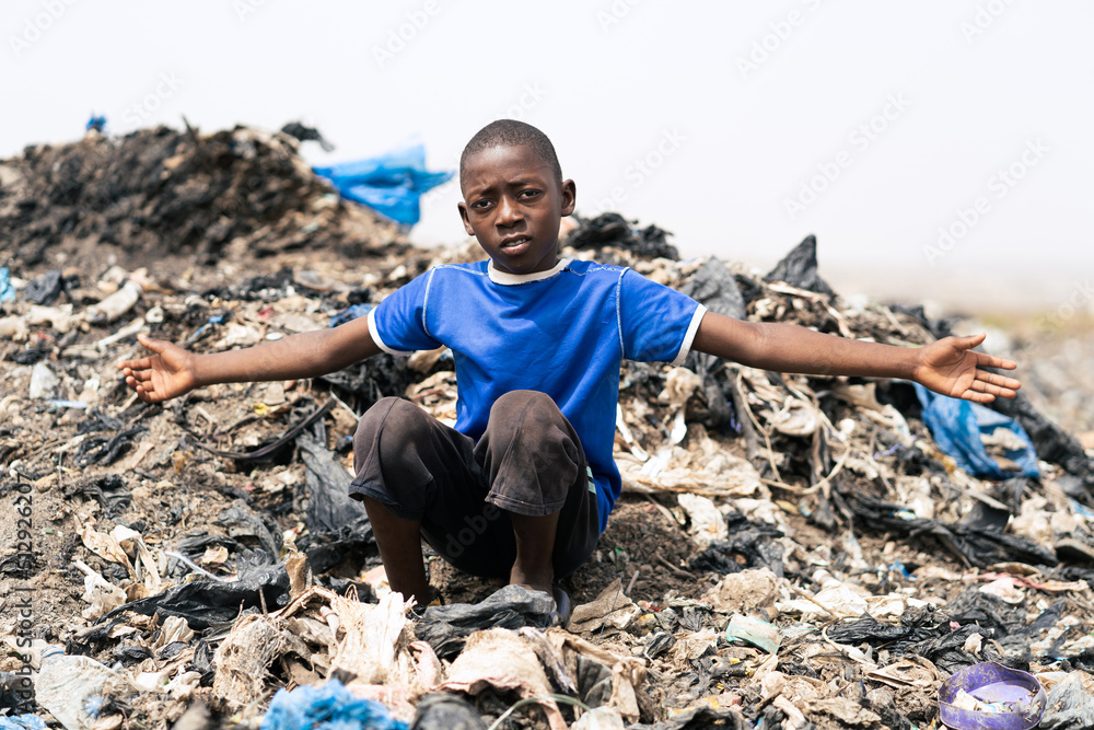Photo & Art Print Young black African boy inviting the viewer to ...