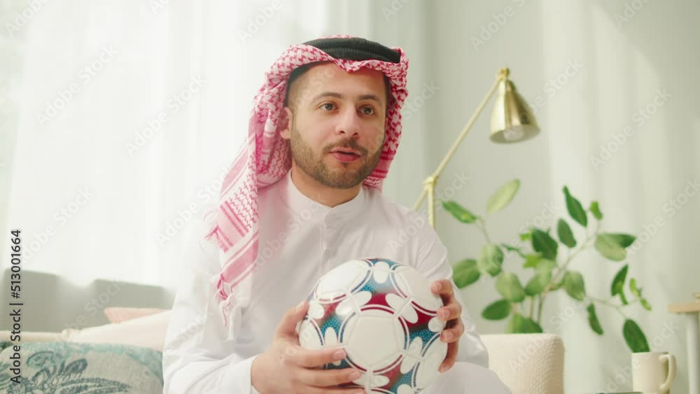 Middle eastern football fan supporting favorite team, watching match on ...