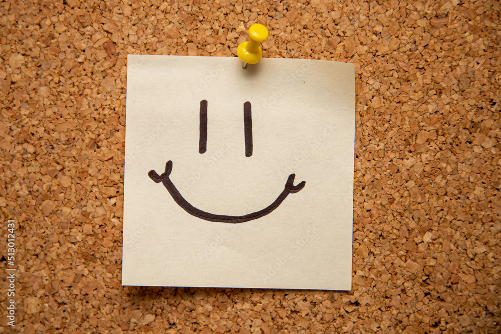 Piece of paper with a smiley face pin on a corkboard Stock Photo ...