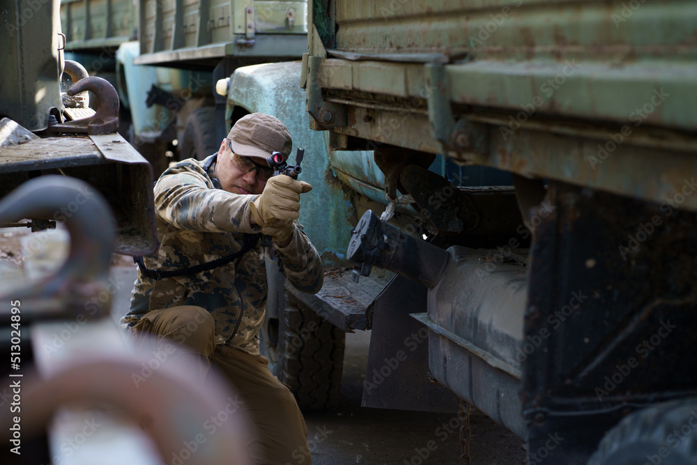 Defensive tactics shooter course, man with a gun in military uniform ...