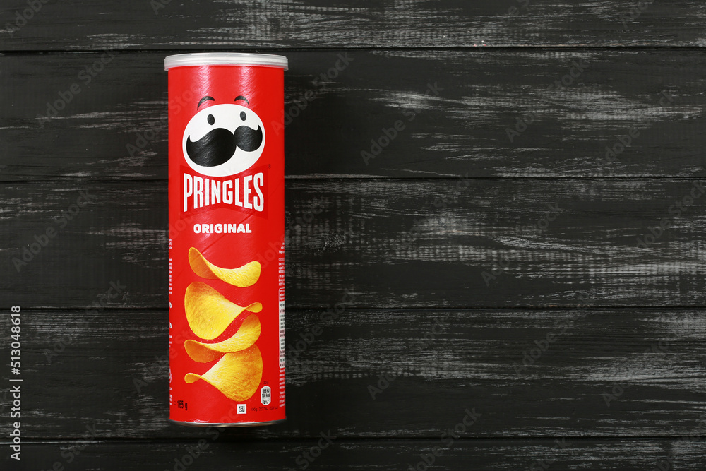 Pringles potato chips in a box on wooden background with copy space ...