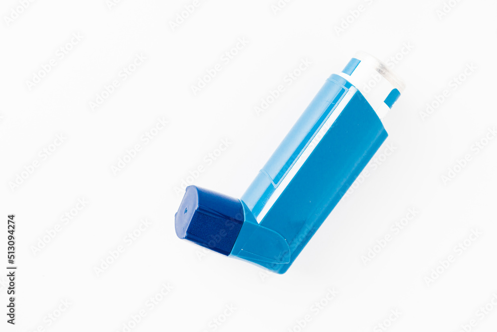 Blue asthma inhaler with blank label isolated on white background ...