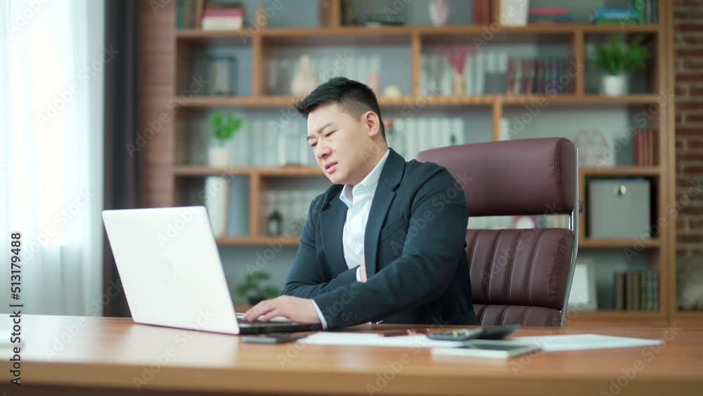 Asian male businessman office worker with severe heart pain. holding chest with a heart attack ...