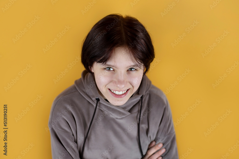 Happy teen girl smiling, she is 12-14 years old and she easily goes ...