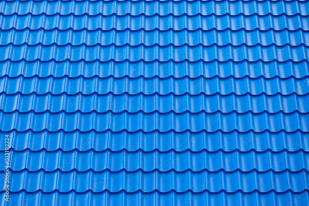 Architectural textured background of blue roof metal tile. Roof of a ...