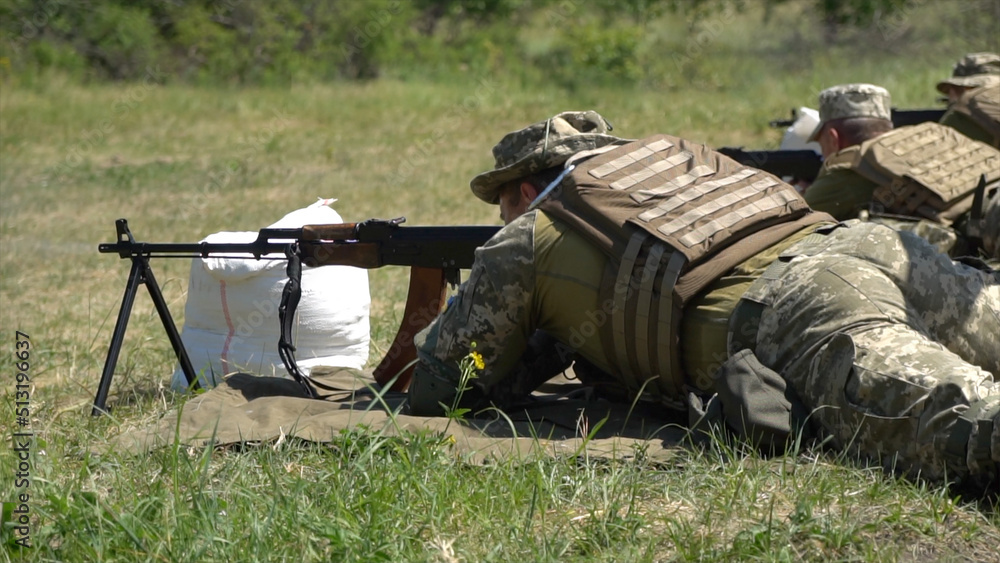 Ukrainian military shoots from a submachine gun Stock Photo | Adobe Stock