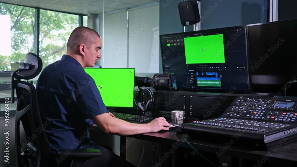 Video editor using software to edit on chroma key green screen, mock up ...