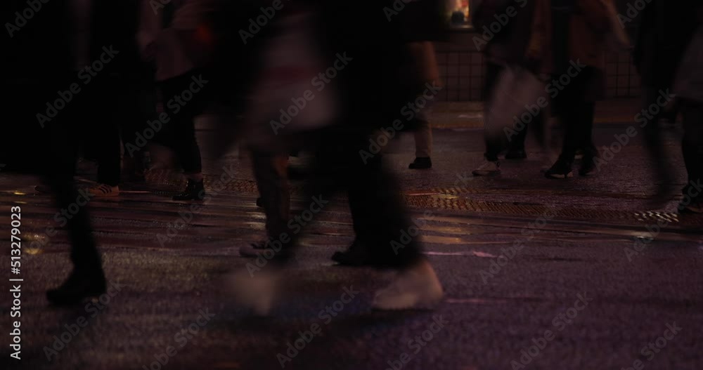 A high speed shooting of walking people body parts at Shibuya crossing ...