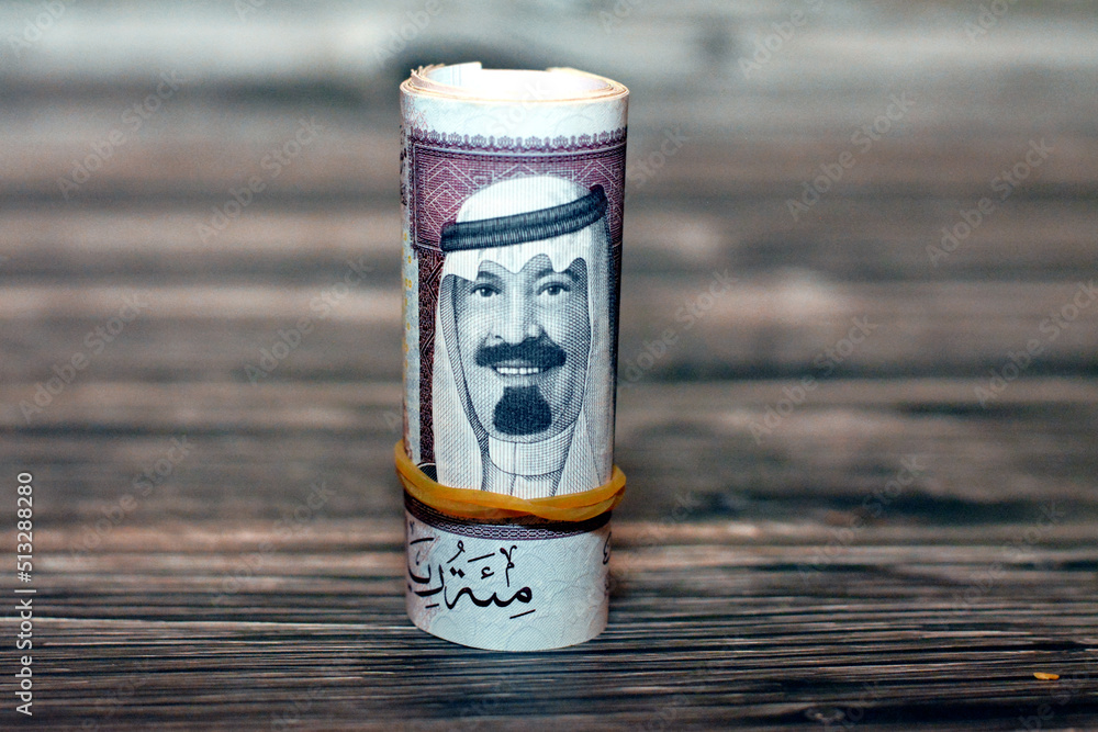 100 SAR one hundred Saudi riyals cash money banknote bills rolled up ...