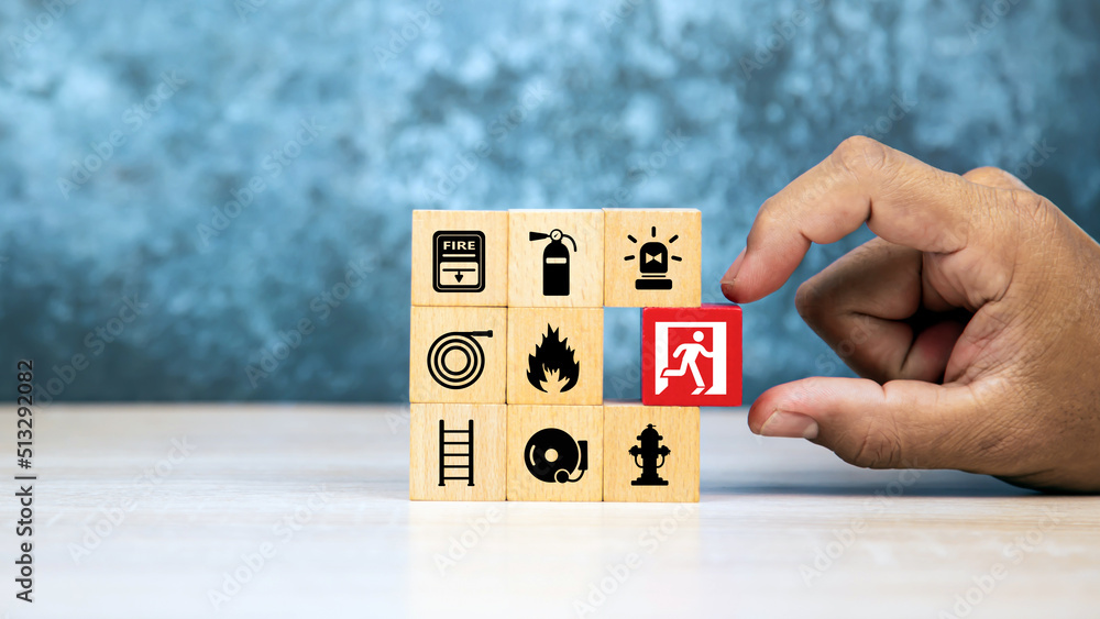 Hand choose wooden block stack with door exit sing or fire escape and ...