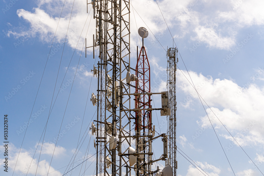 Metallic towers with communication antennas for radio, telephone and ...