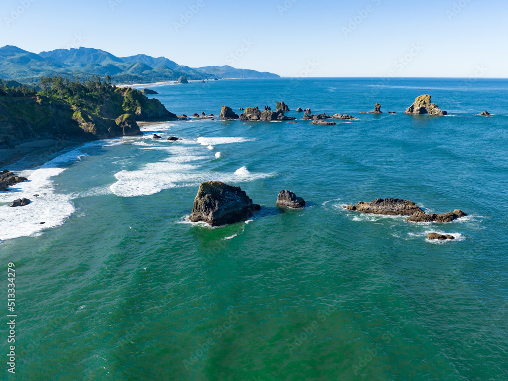 Rugged sea stacks lie just off the Northern Oregon shoreline, not far ...