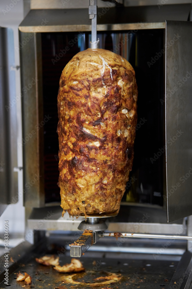 shawarma on a spit. Doner kebab on a rotating vertical spit ...