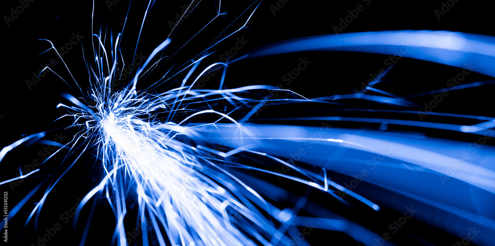 blue sparks in the dark. lines of light. Stock Photo | Adobe Stock
