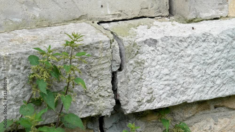 Crack in the foundation of a building from an earthquake close-up ...