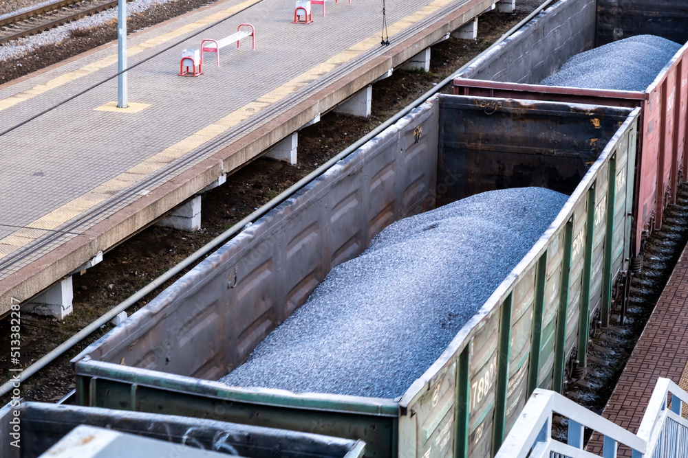 Transportation of rubble in the train. Wagon with building materials ...