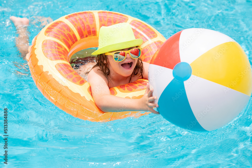 Kids swimming and playing in a pool. Child playing in swim pool. Summer ...