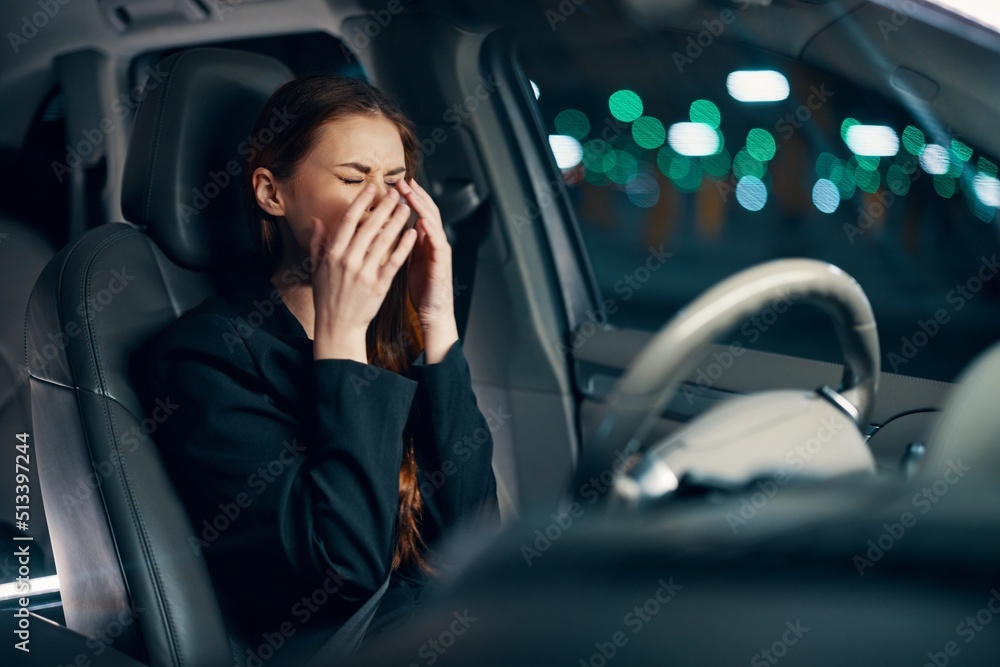 a frustrated, emotional, crying woman is sitting behind the wheel of a ...