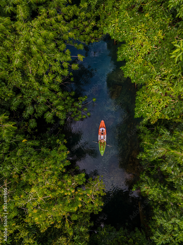 couple in a kayak in the jungle of Krabi Thailand, men and woman in ...