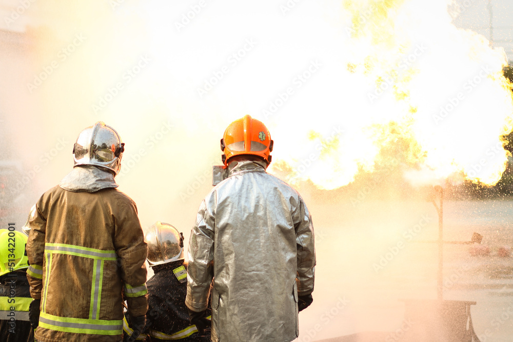 Firefighters using Twirl water fog type fire extinguisher to fighting ...