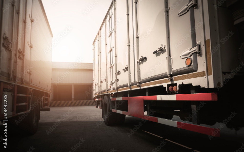 Cargo Container Trucks Parked at Distribution Warehouse with the Sunset ...