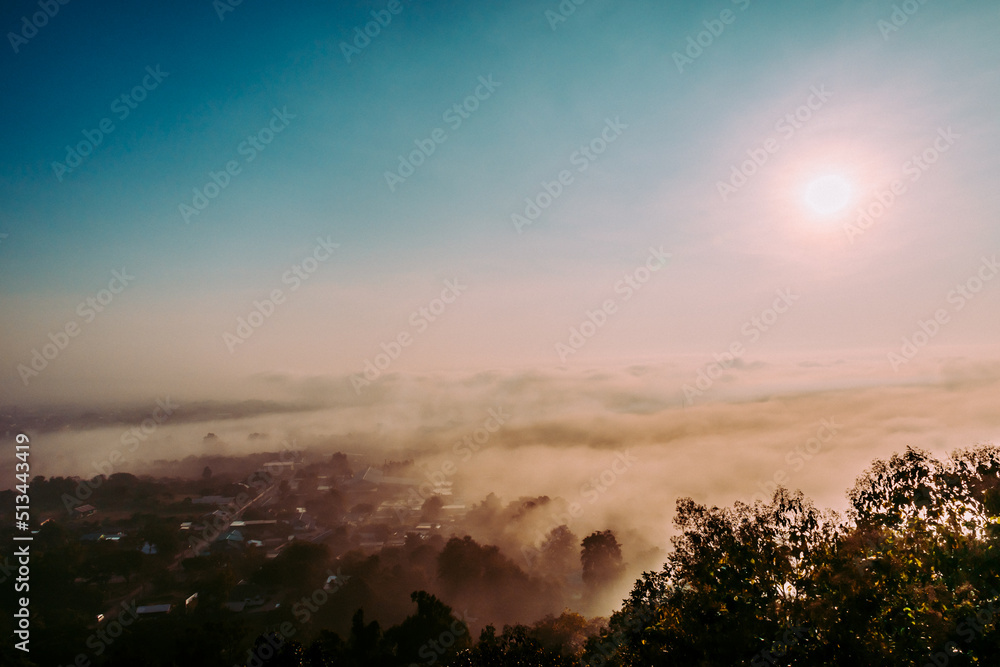 The mist engulfed the city in the morning with the rising sun ...