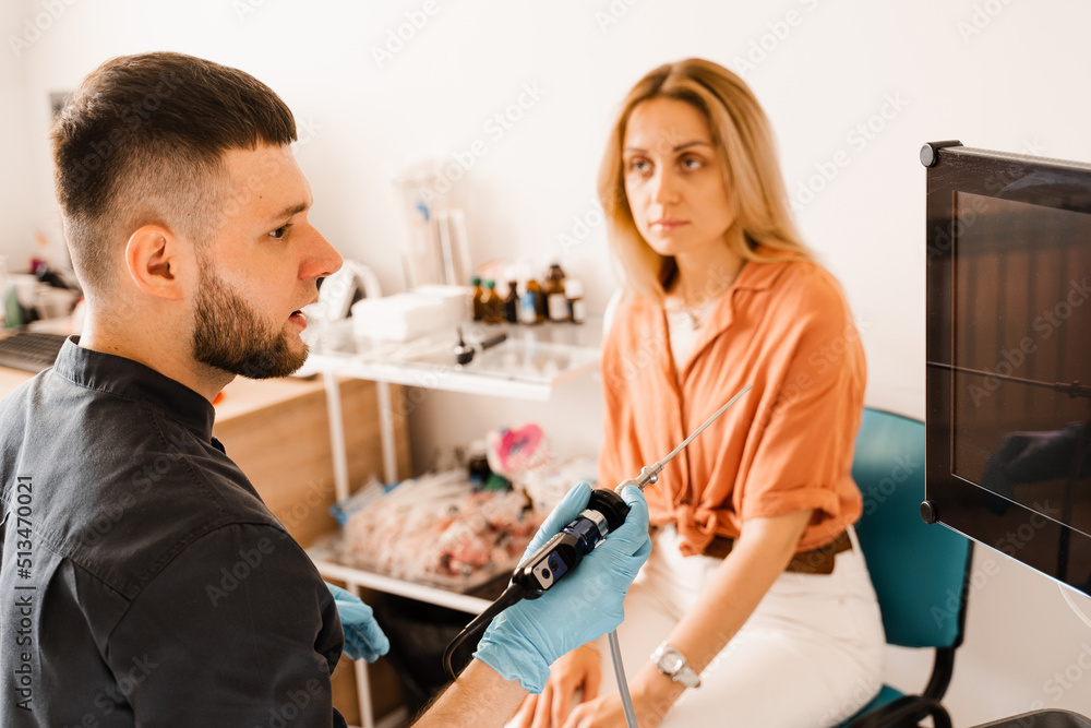 Doctor otolaryngologist with rhinoscope for endoscopy. Consultation ...