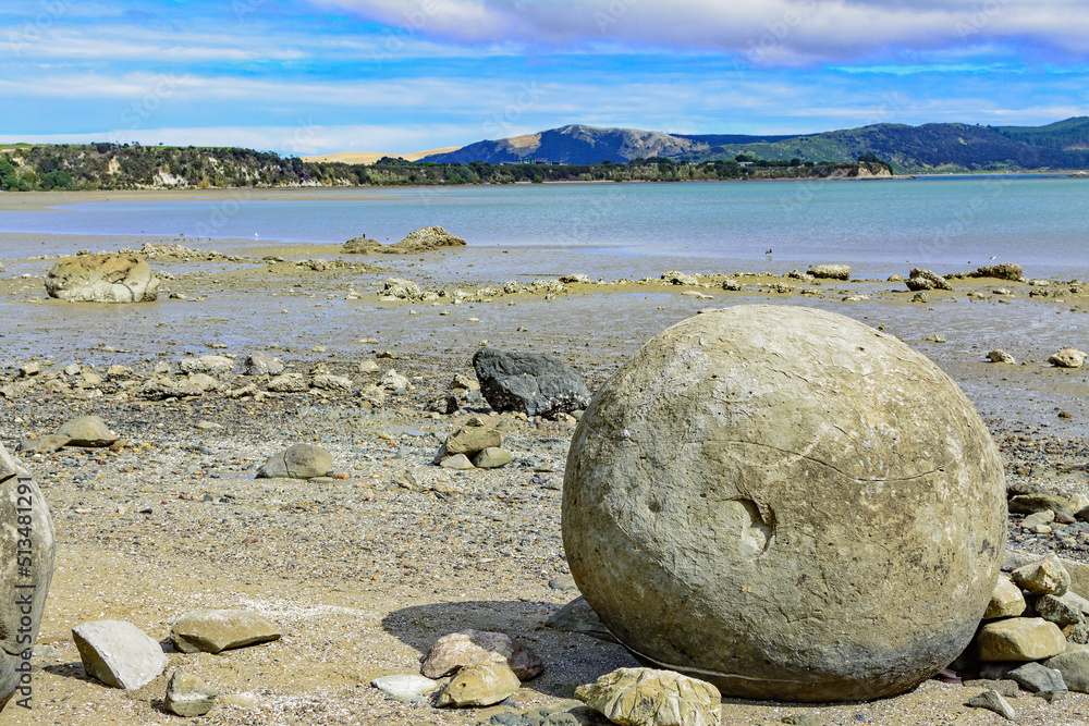 Perfect round concretion on a sandy beach. Koutu boulders, Hokianga ...