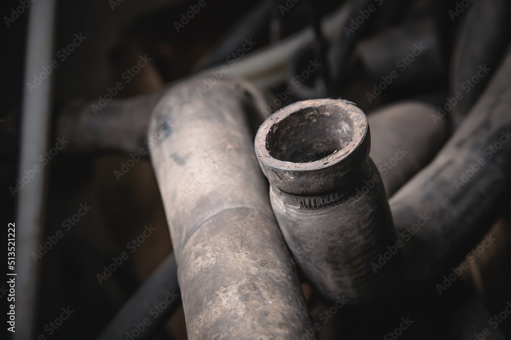 Rubber pipes and hoses leading from the car radiator to the engine ...