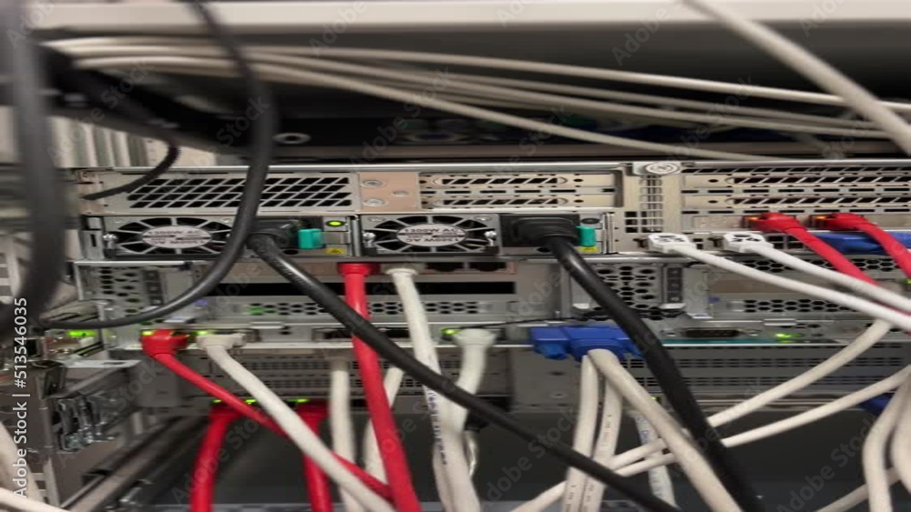 Rear view of a server in a server room with its network connections and ...